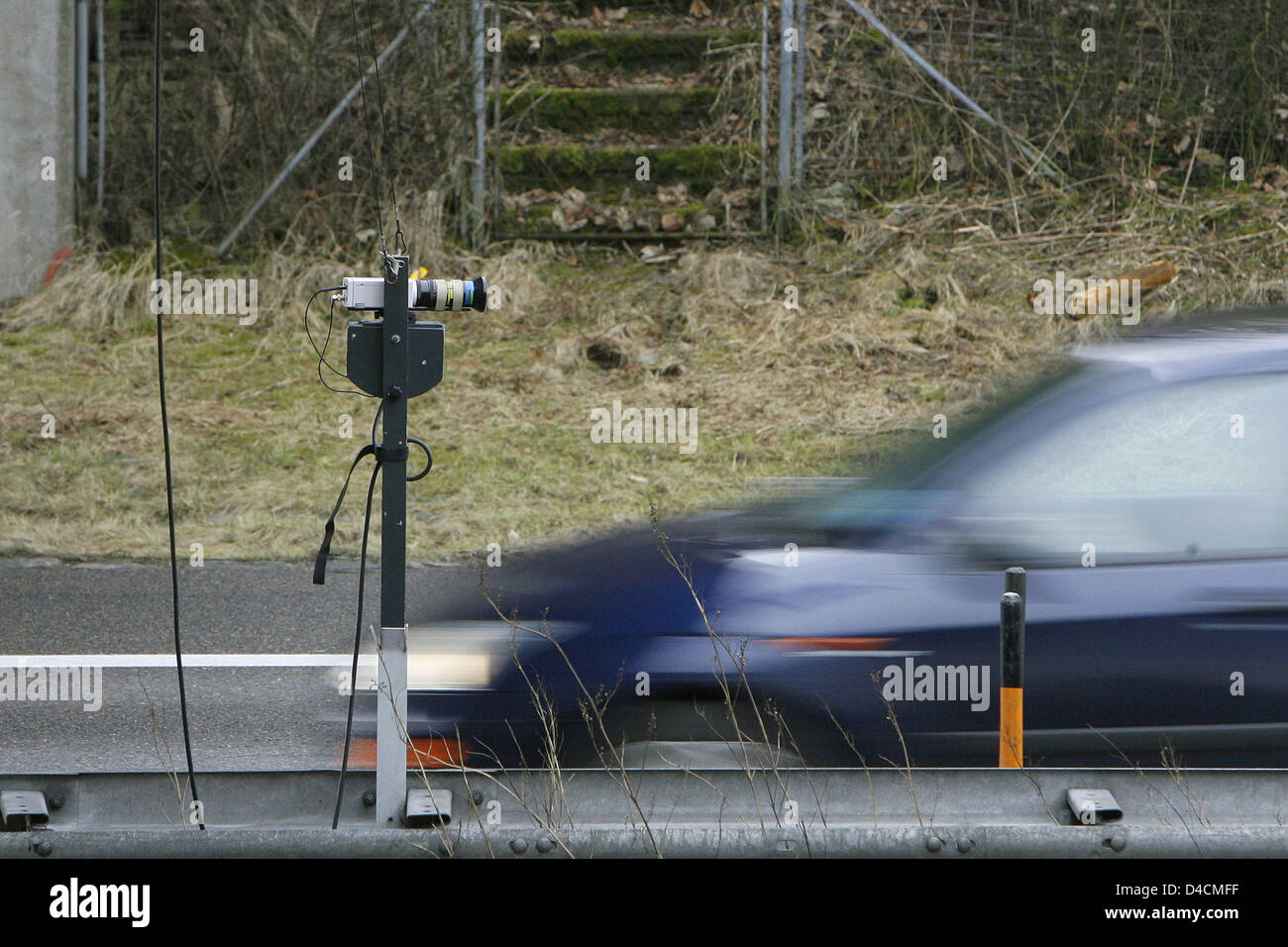 A video camera of the traffic control police measures the distance ...