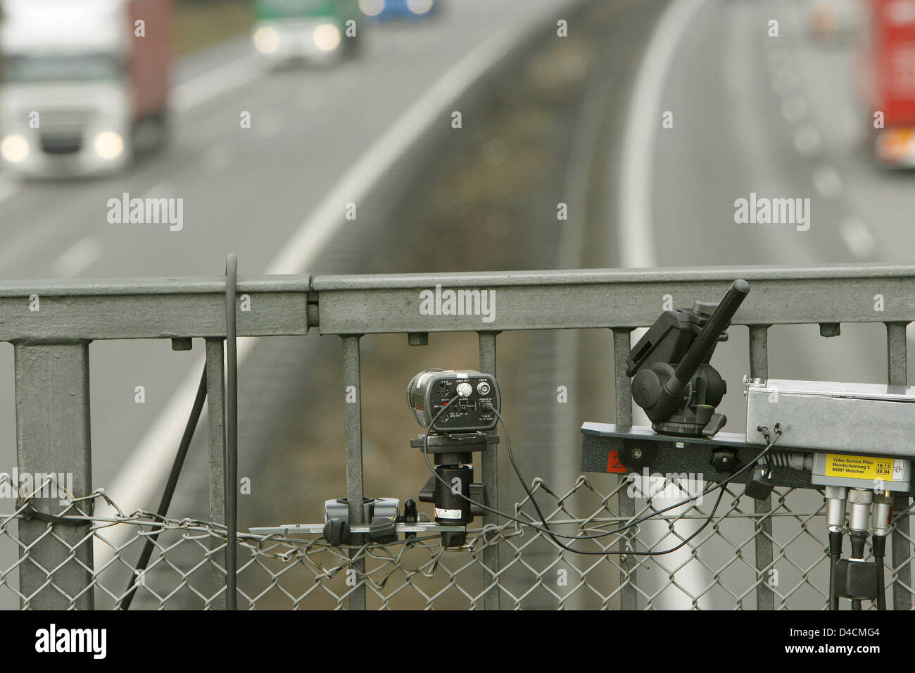 A video camera of the traffic control police measures the distance ...