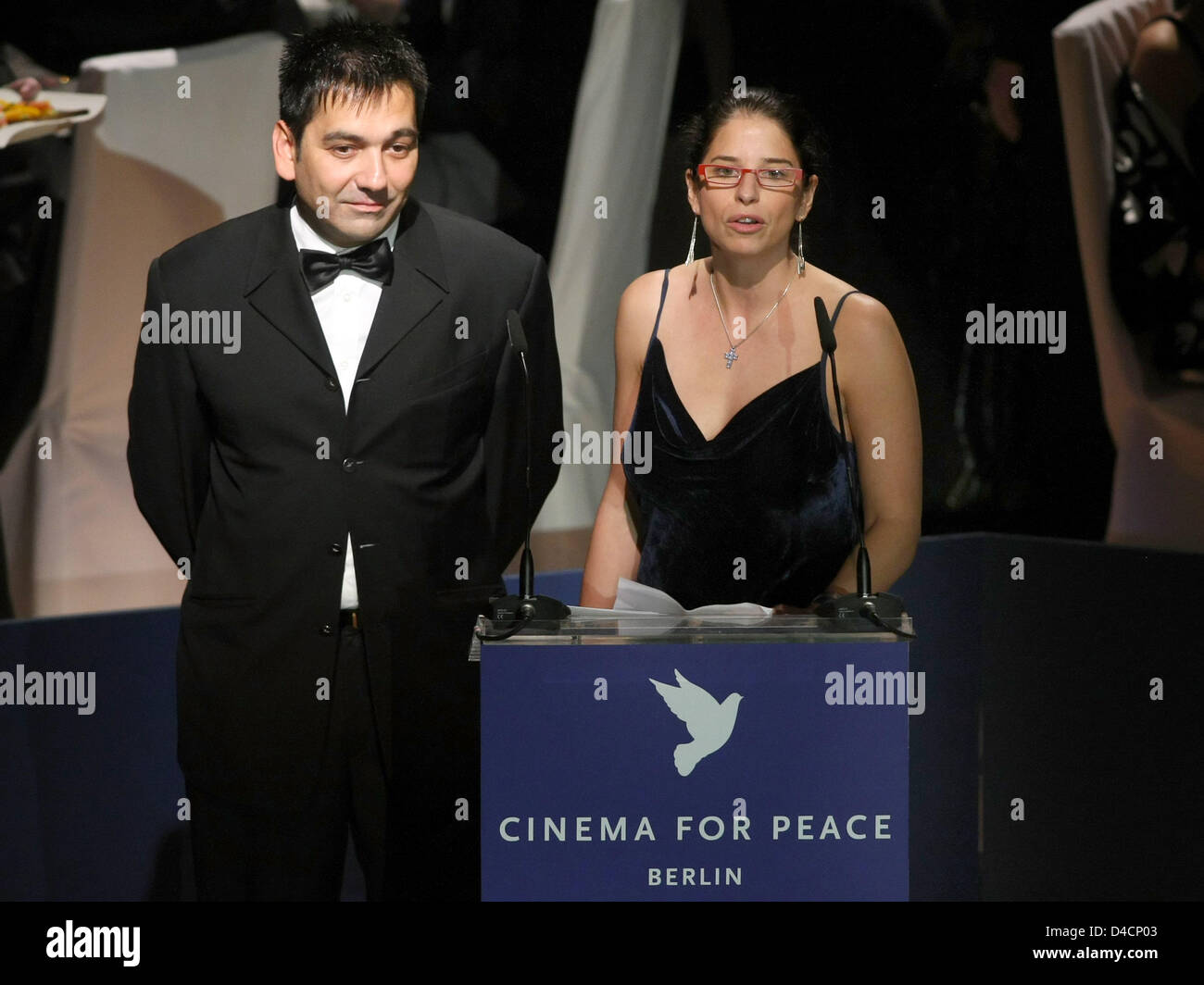 Director Mark Linfield (L) and company (R) hold their acceptance speech ...