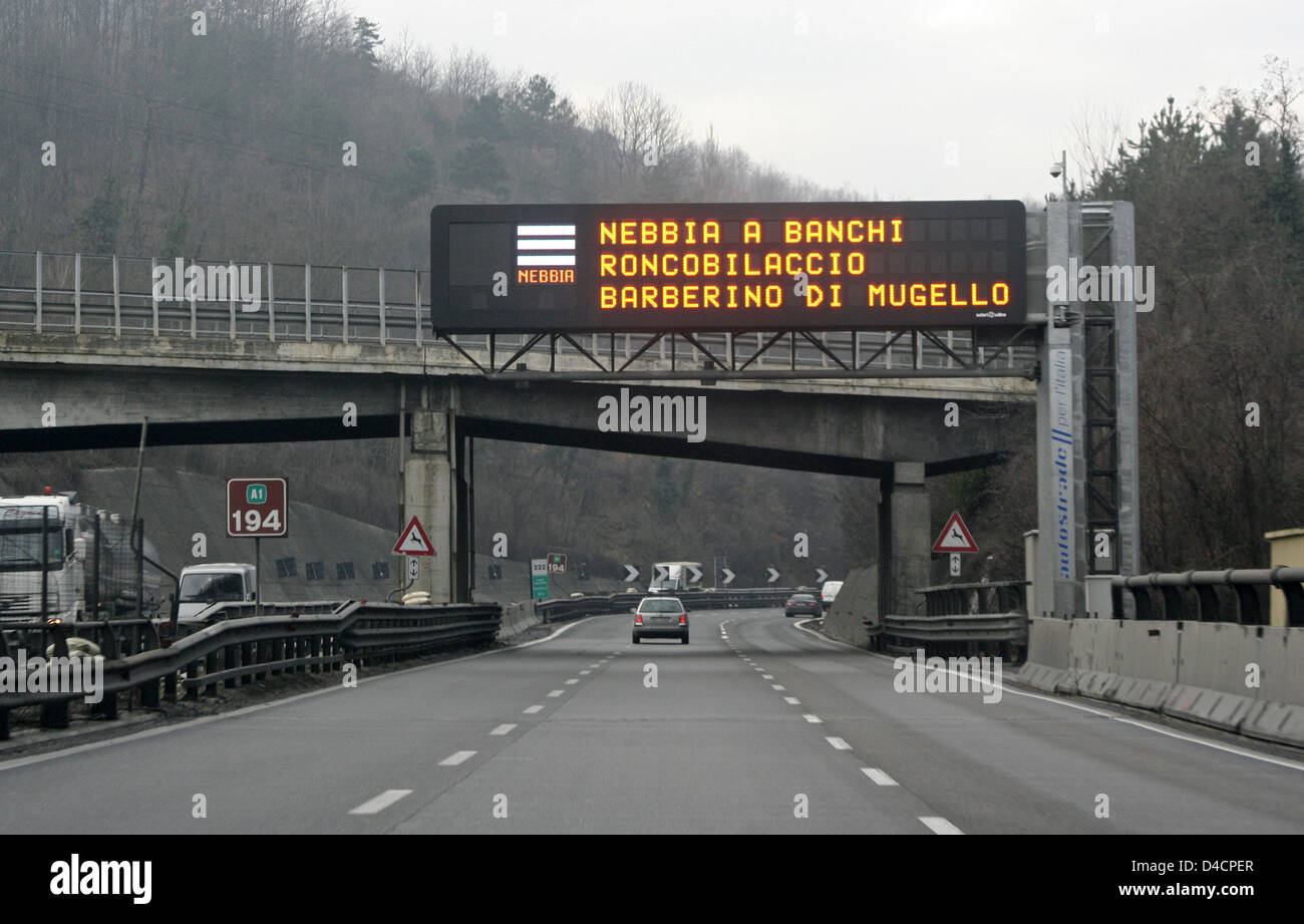 Display panels indicates a fog warning on a motorway tunnel between ...