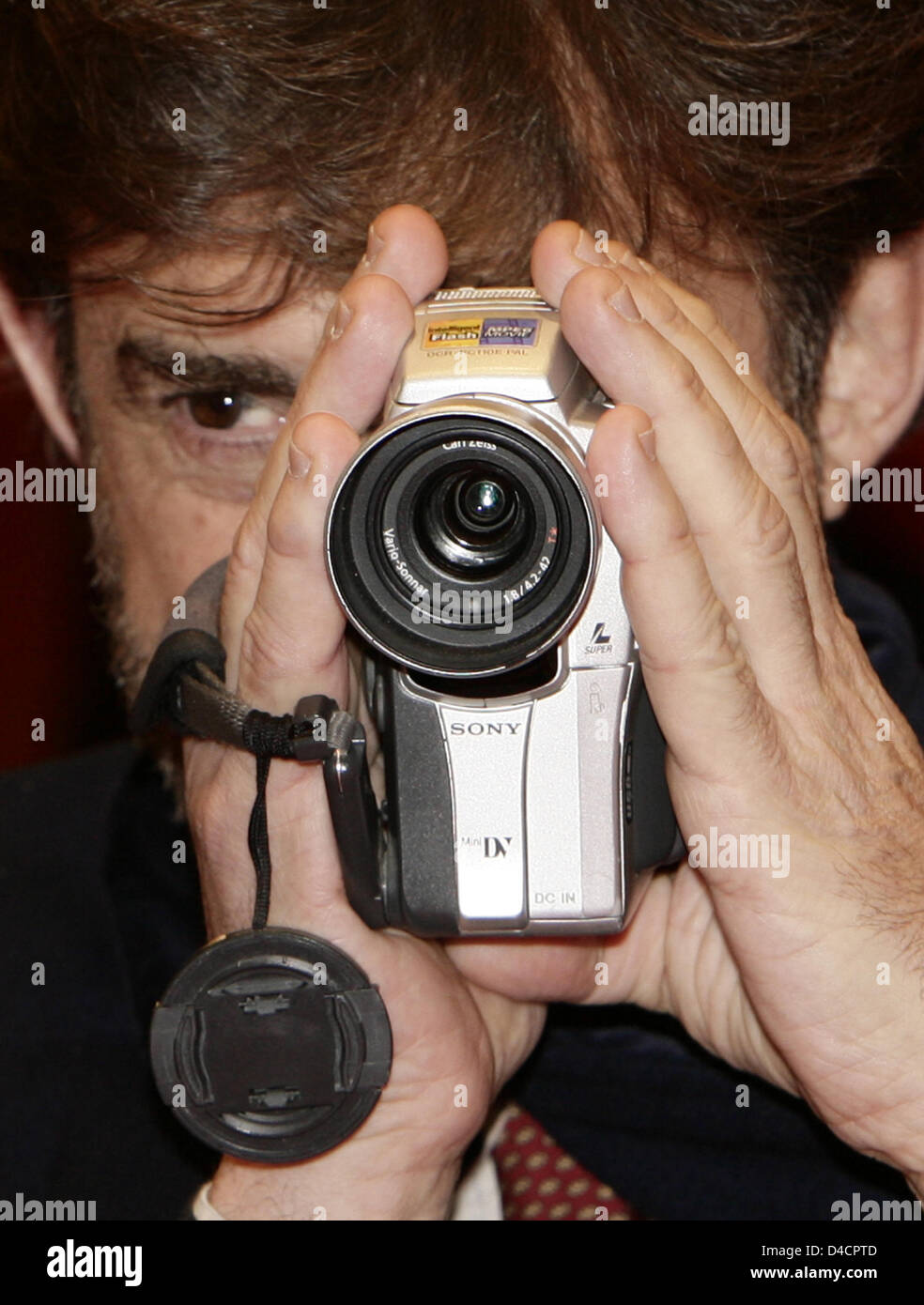 Italian actor Nanni Moretti films as he arrives on the red carpet for ...
