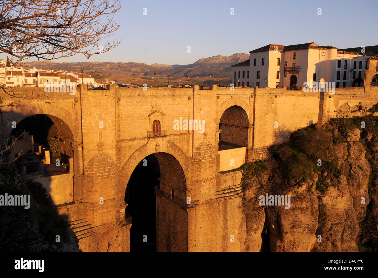 The picture shows a bridge over a deep canyon connecting two parts of ...