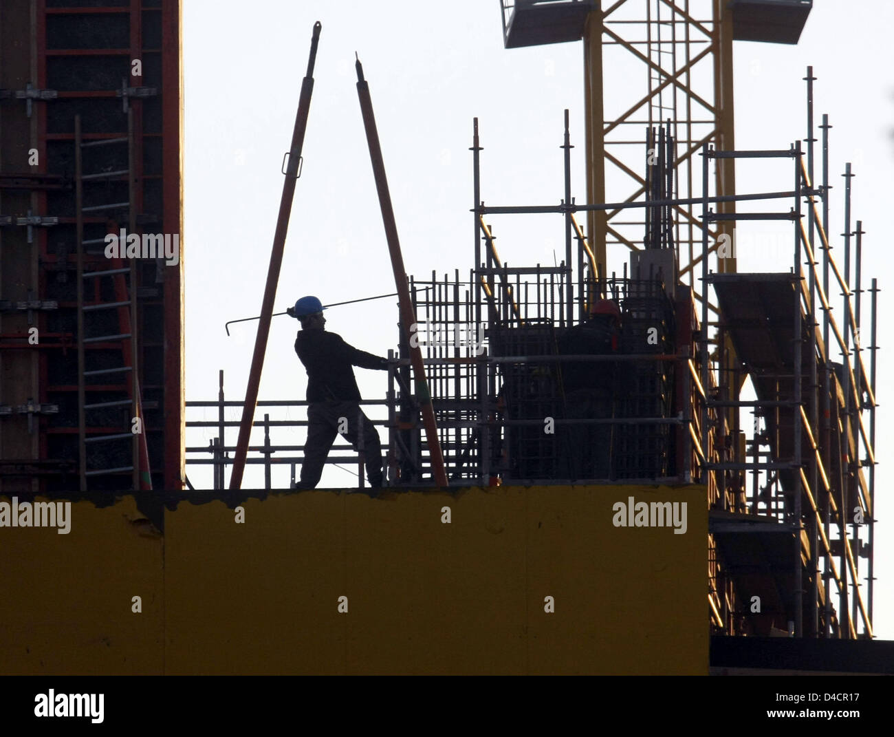 A construction worker is pictured at a construction site in Frankfurt ...