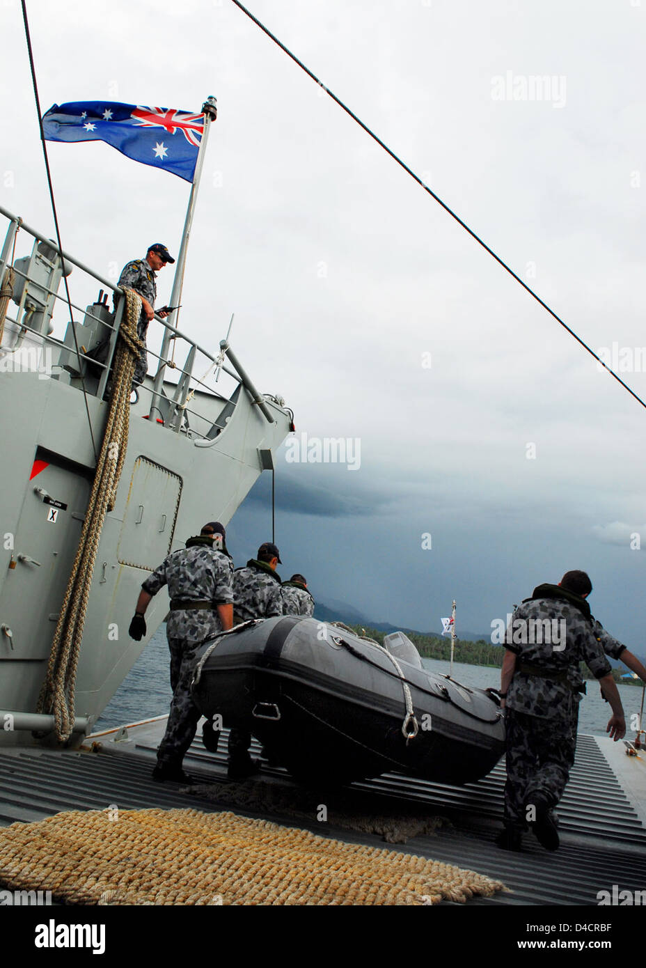 Australian Royal Navy Sailors Carry a Rigid Hull Inflatable Boat to the ...
