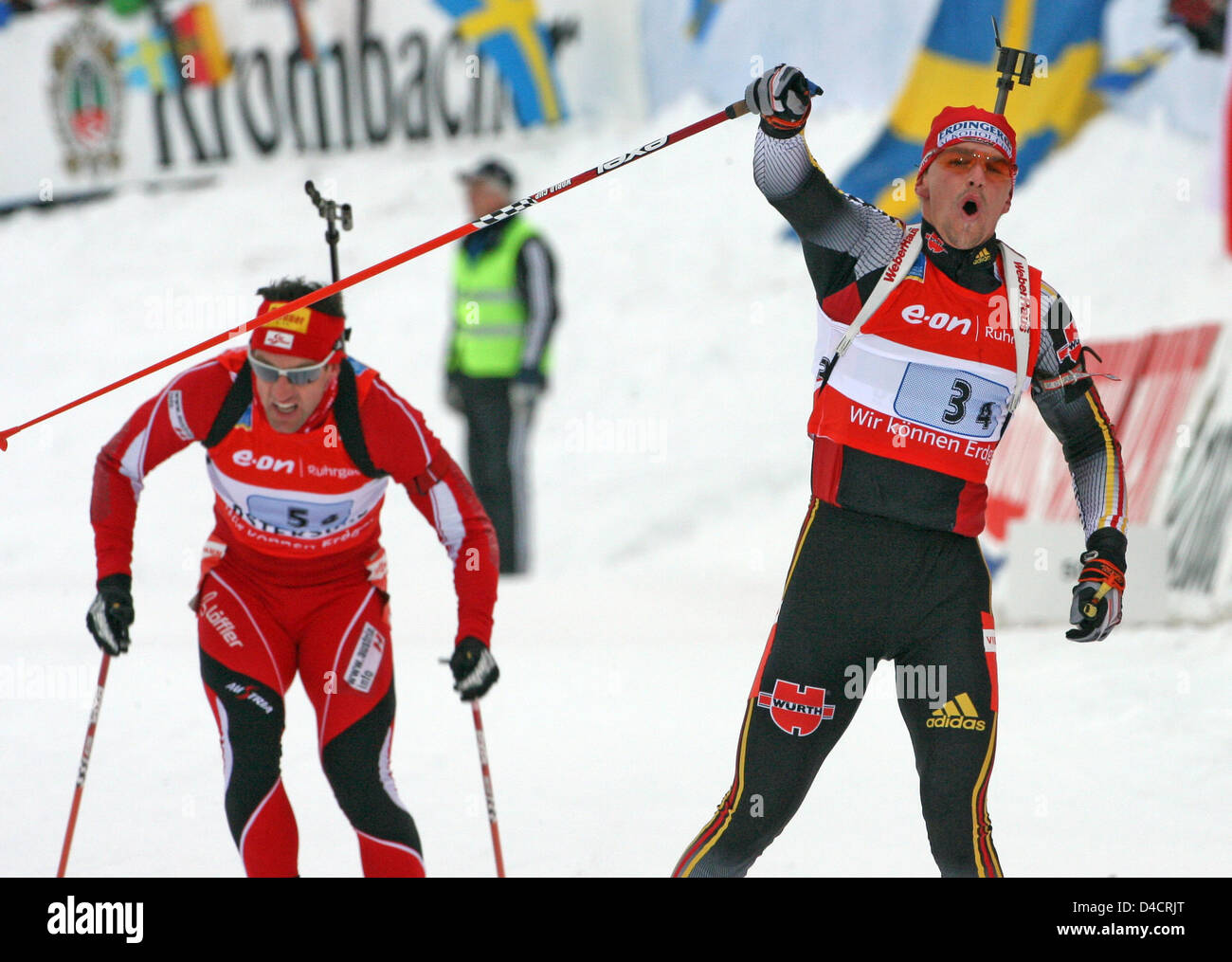 Germany's Michael Greis (R) brings home the bronze medal in the 4x7.5km ...