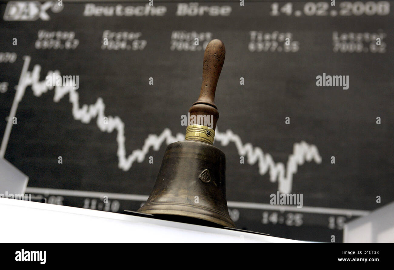 The traditional stock exchange bell is pictured in front of a display ...