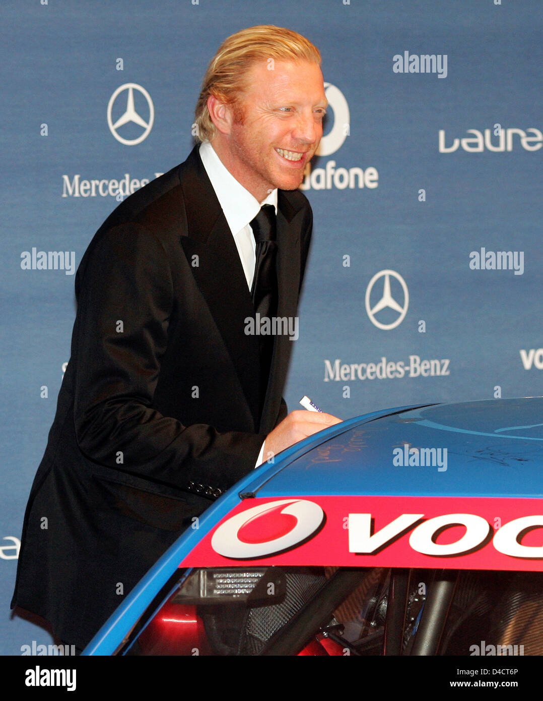 German tennis legend Boris Becker signs a car on the red at the ...