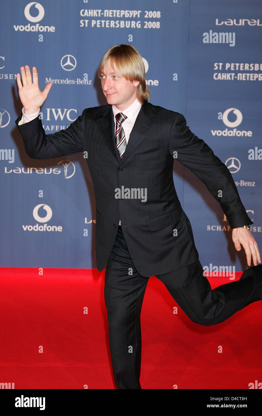 Russian figure skater Yevgeny Plushenko poses on the red carpet as he ...