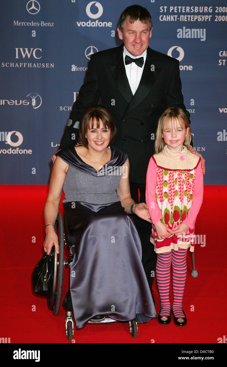 British wheelchair athlete Tanni Grey-Thompson (L) and her family pose ...
