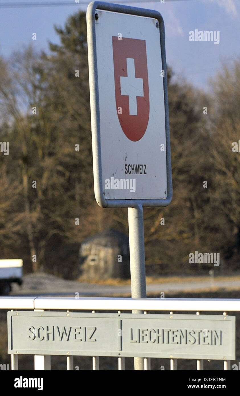 The picture shows the border sign of Liechtenstein and Switzerland near ...