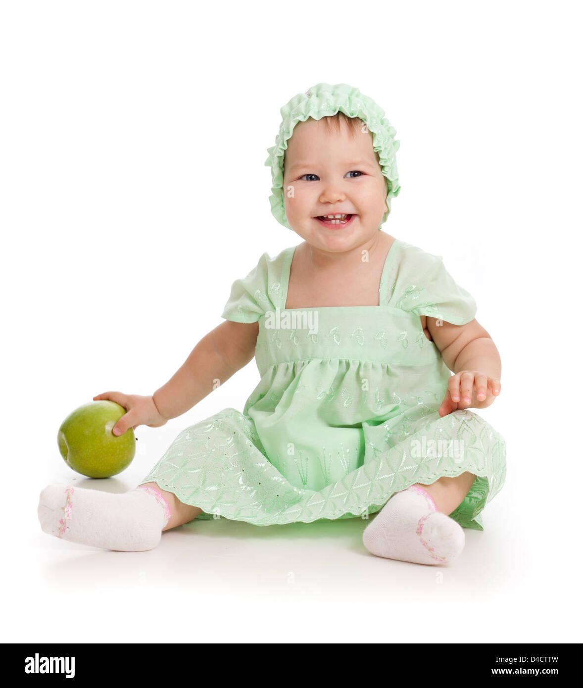 baby girl with green apple Stock Photo - Alamy