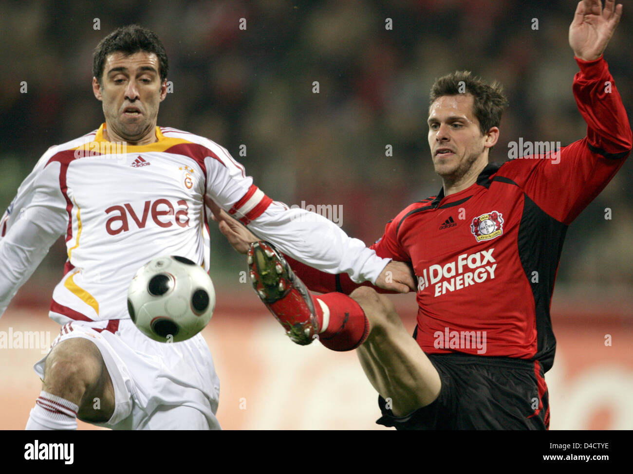 Leverkusen's Manuel Friedrich (R) and Instanbul's Hakan Suekuer vie for ...