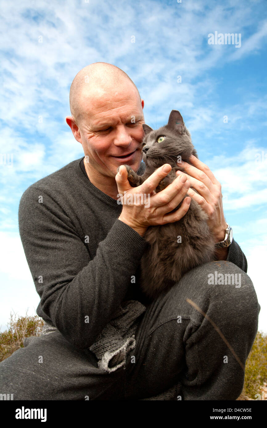 Man and his cat Stock Photo - Alamy