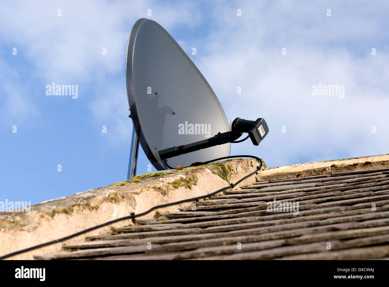 Satellite aerial dish on a remote house in rural Aberdeenshire Stock ...