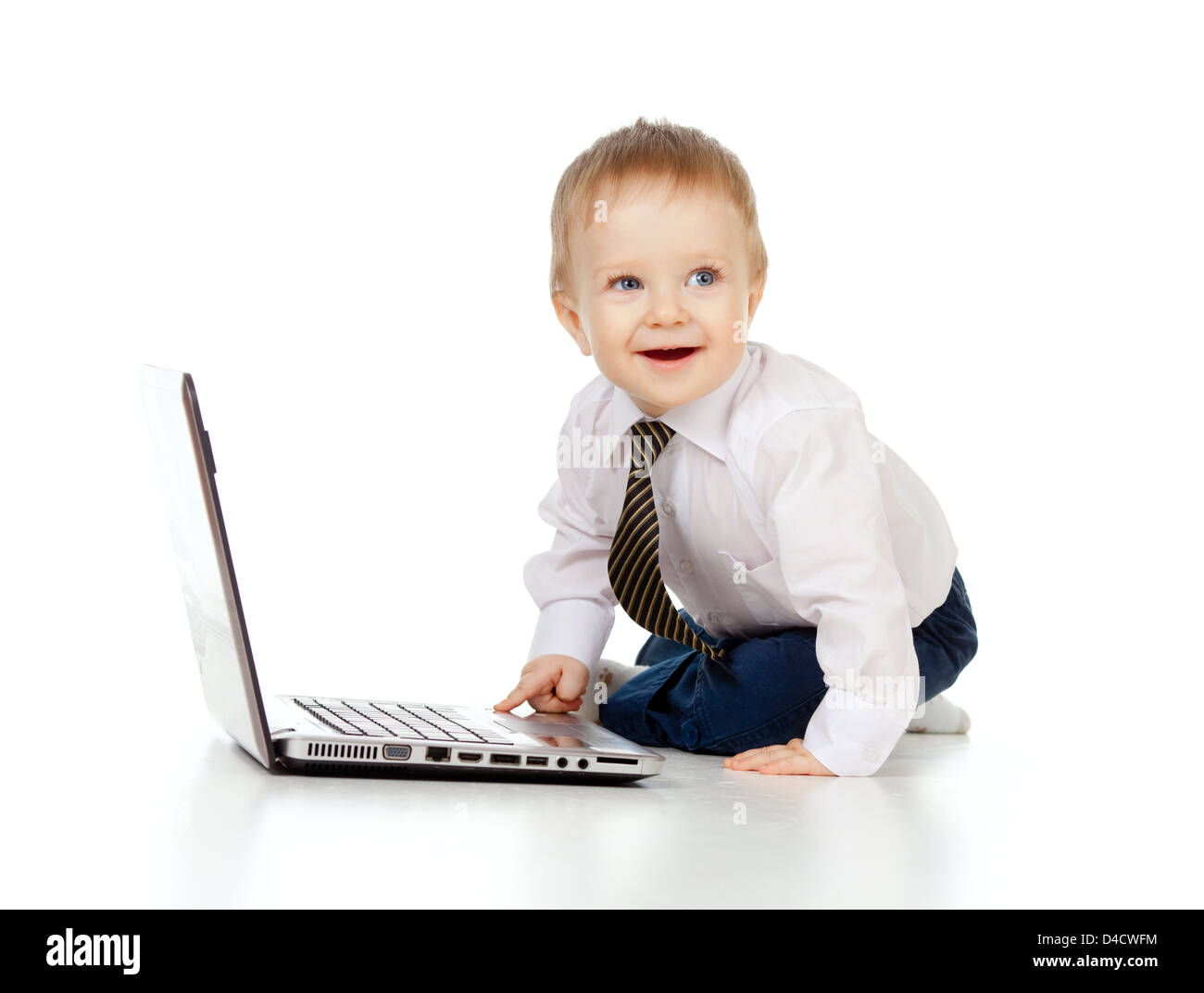 Cute child using laptop Stock Photo - Alamy