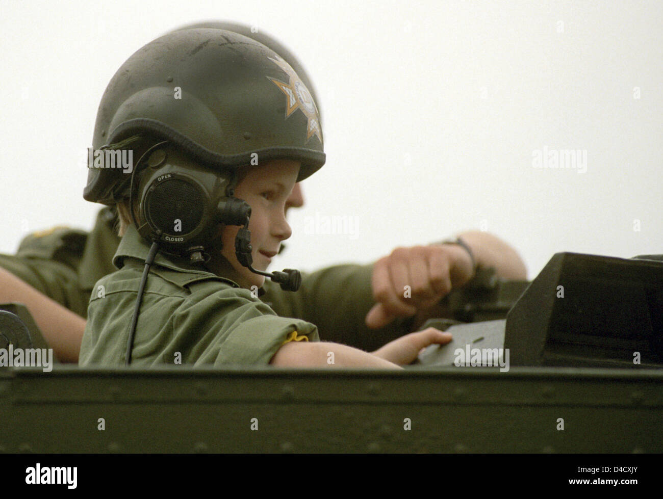 (dpa file) - Prince Harry (L) looks out of a tank turret during a visit ...