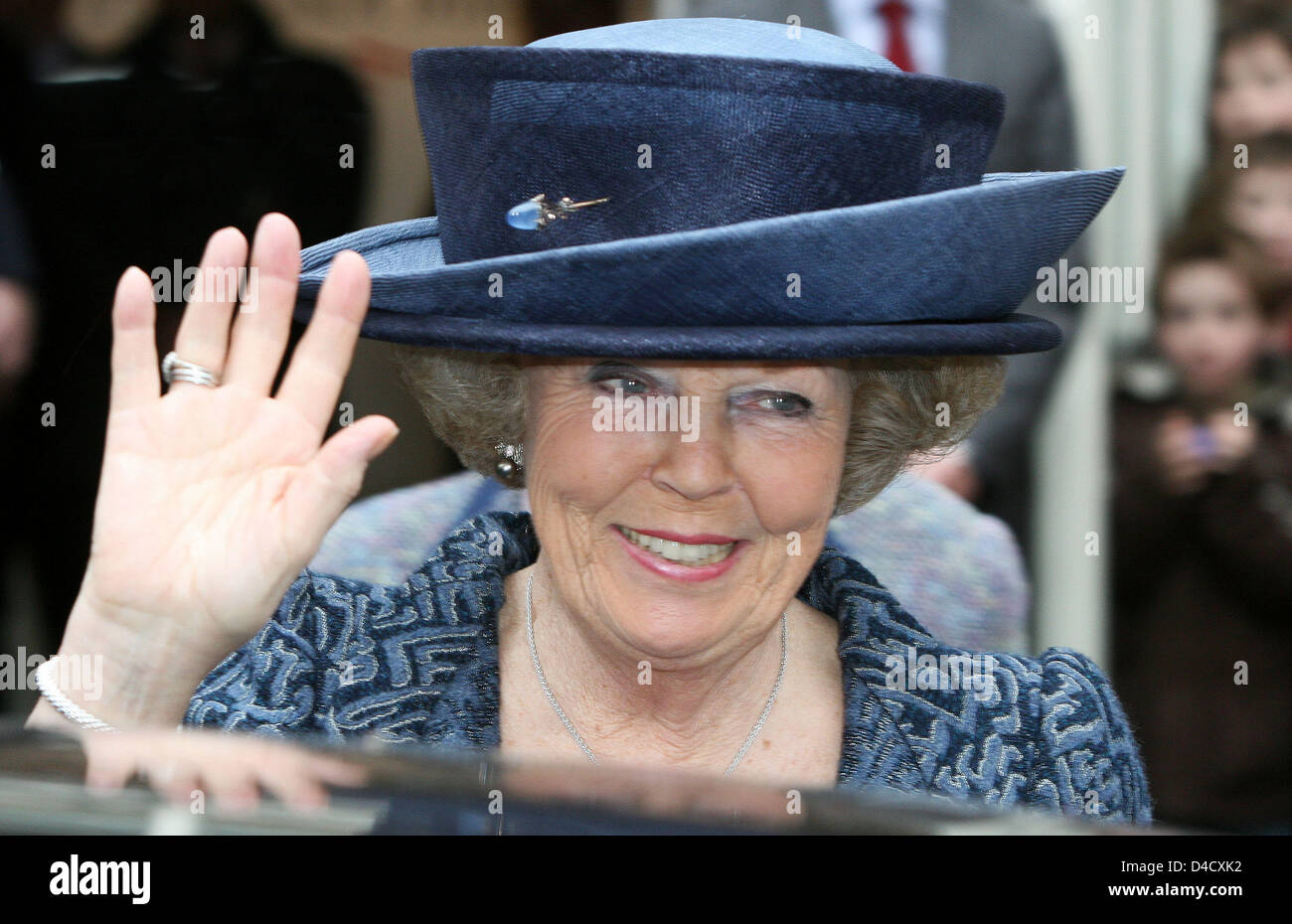 Dutch queen Beatrix gestures before the opening of the exhibition ...
