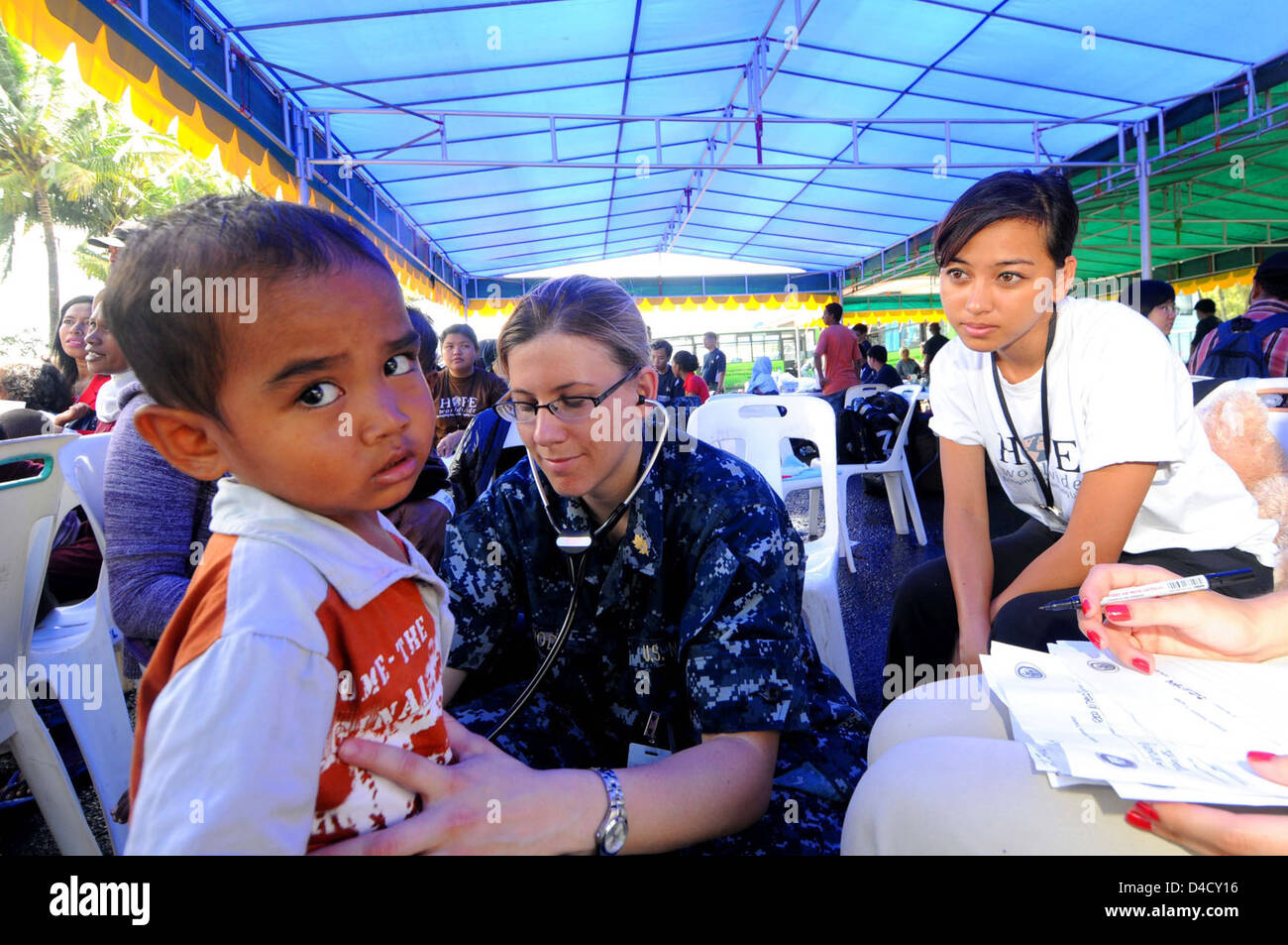 Lt. (Dr.) Stacy Dodt Examines a Young Indonesian Patient Stock Photo ...