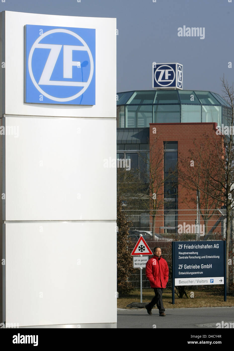 The photo depicts the company logo at the entrance of ZF's headquarters ...