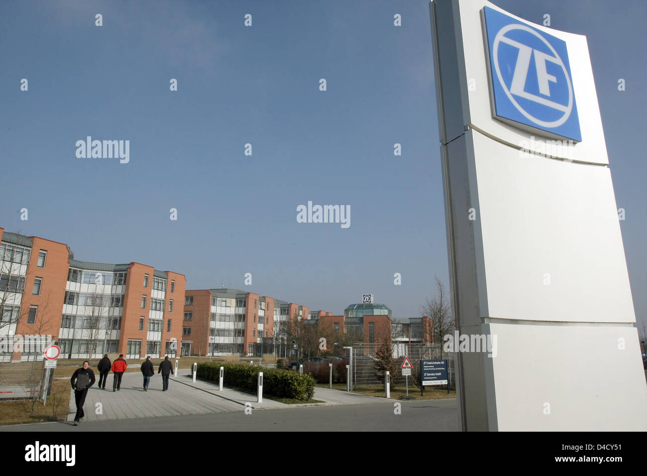 The photo depicts the company logo at the entrance of ZF's headquarters ...