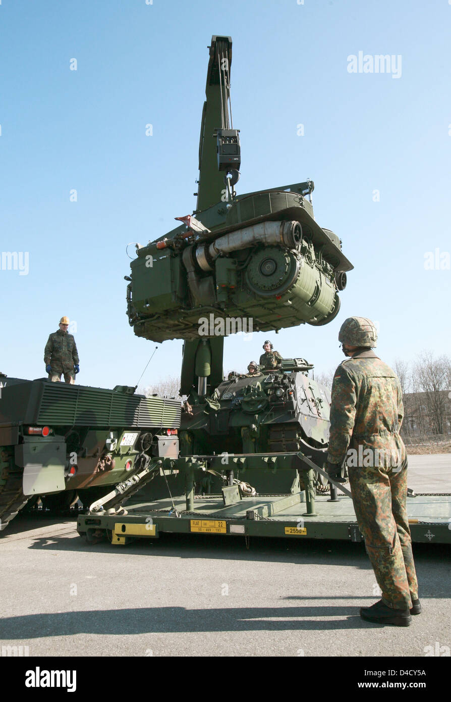 German Bundeswehr engineers exchange the diesel engine of a main battle ...