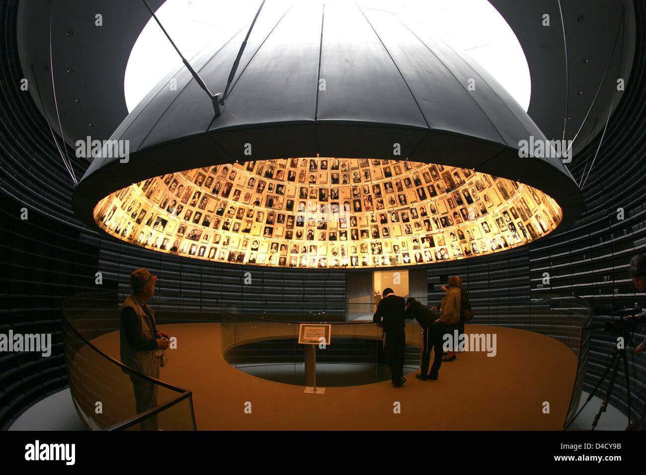Visitors stand in the so-called 'Hall of Names' at the Yad Vashem ...