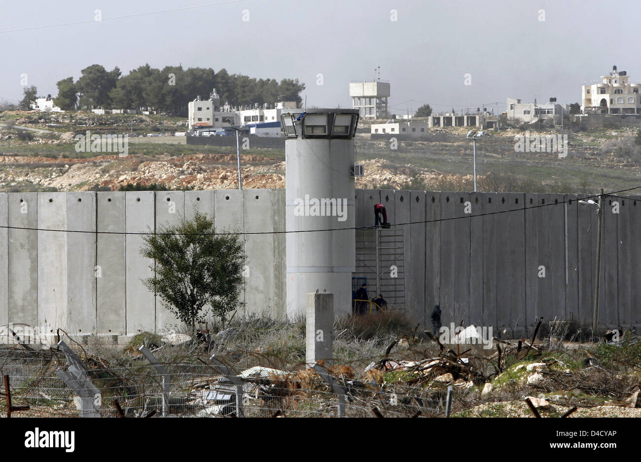 The photo depicts the Israeli security wall near the motorway ...