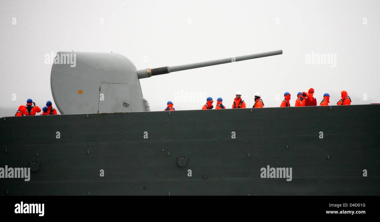 Crew members of Spanish frigate 'Alvaro de Bazan' pictured next to arms ...