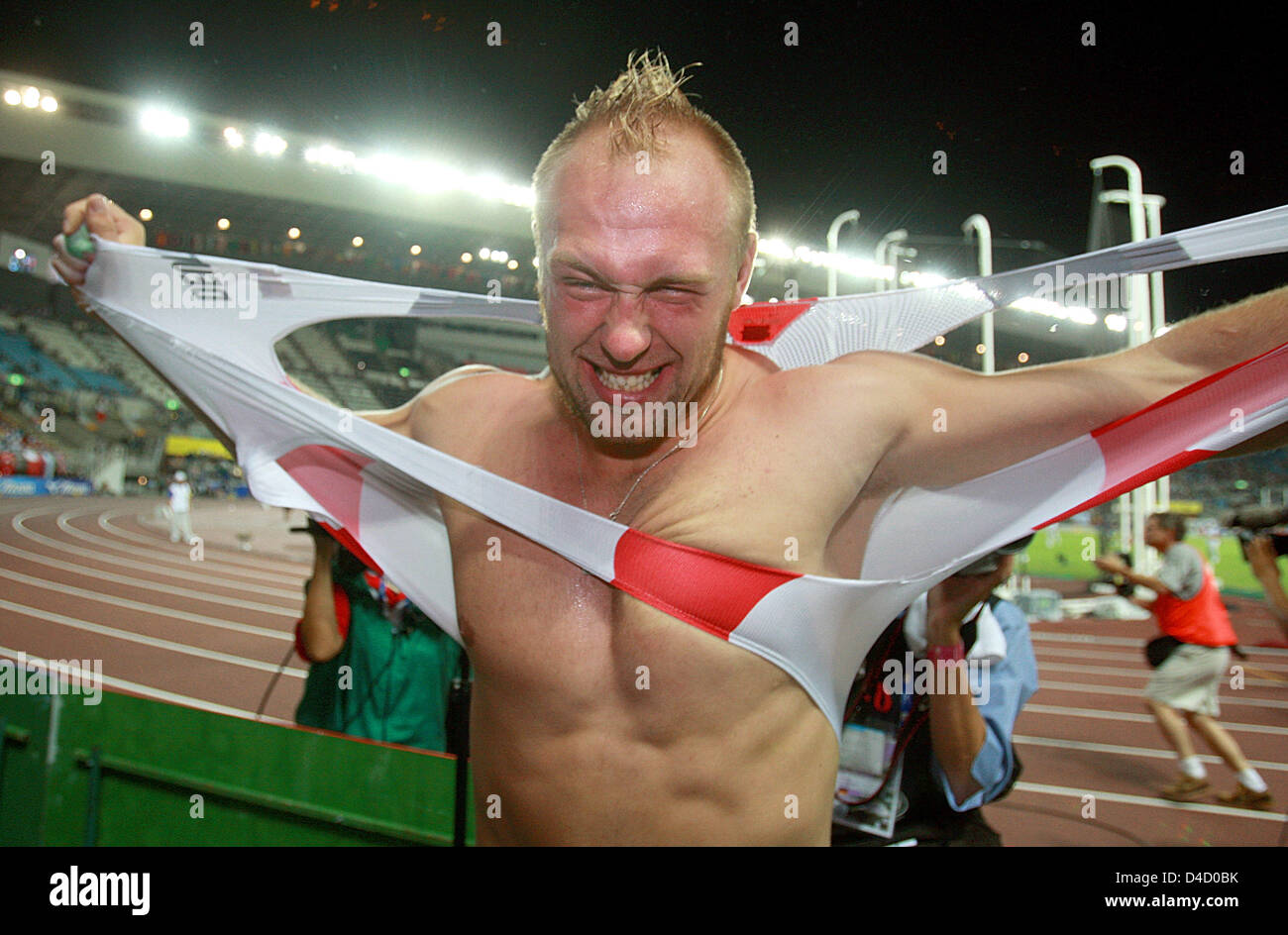 FILE - German javelin thrower Robert Harting celebrates after winning ...