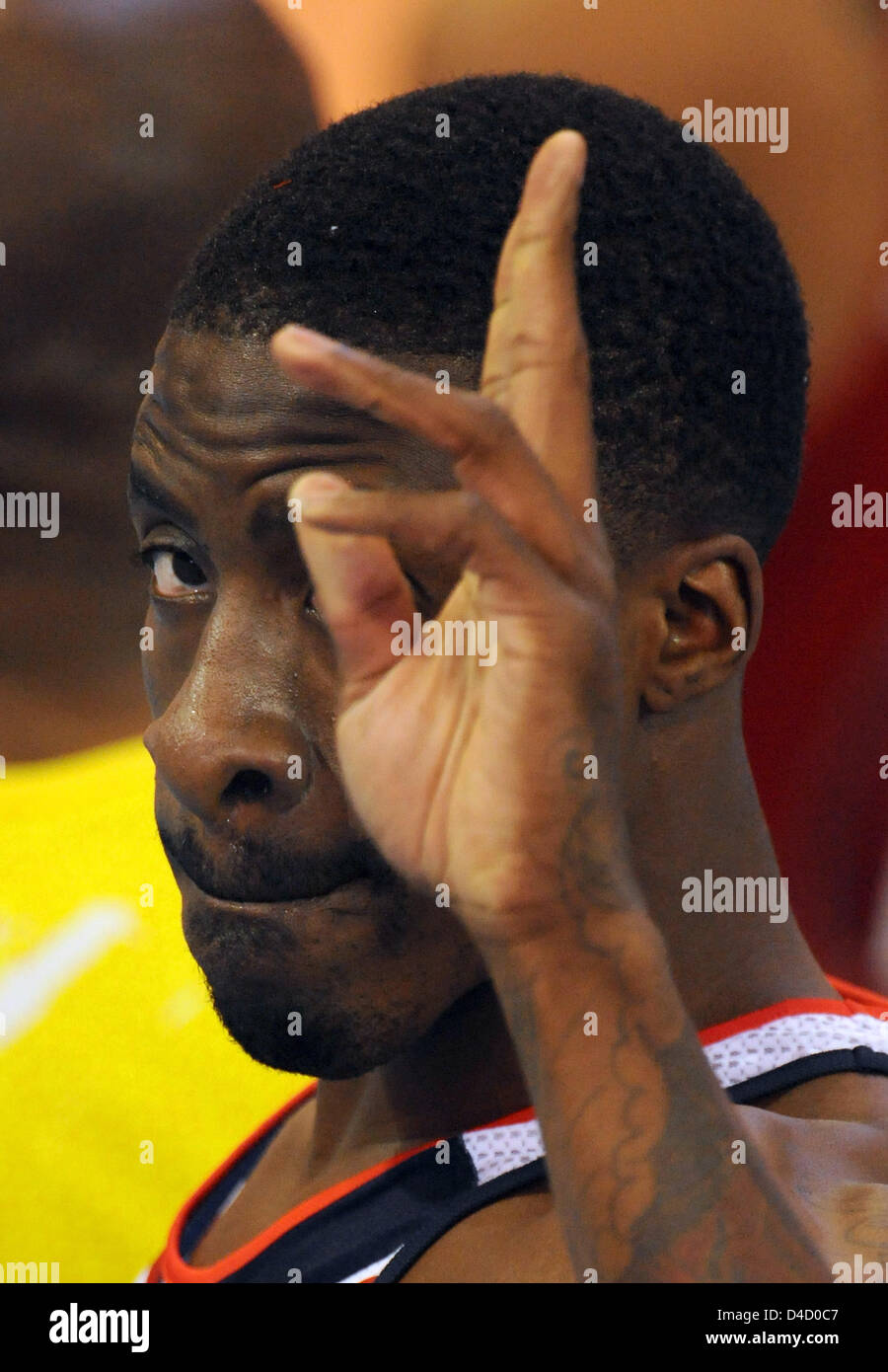British sprinter Dwain Chambers gestures after his 60m preliminary leg ...