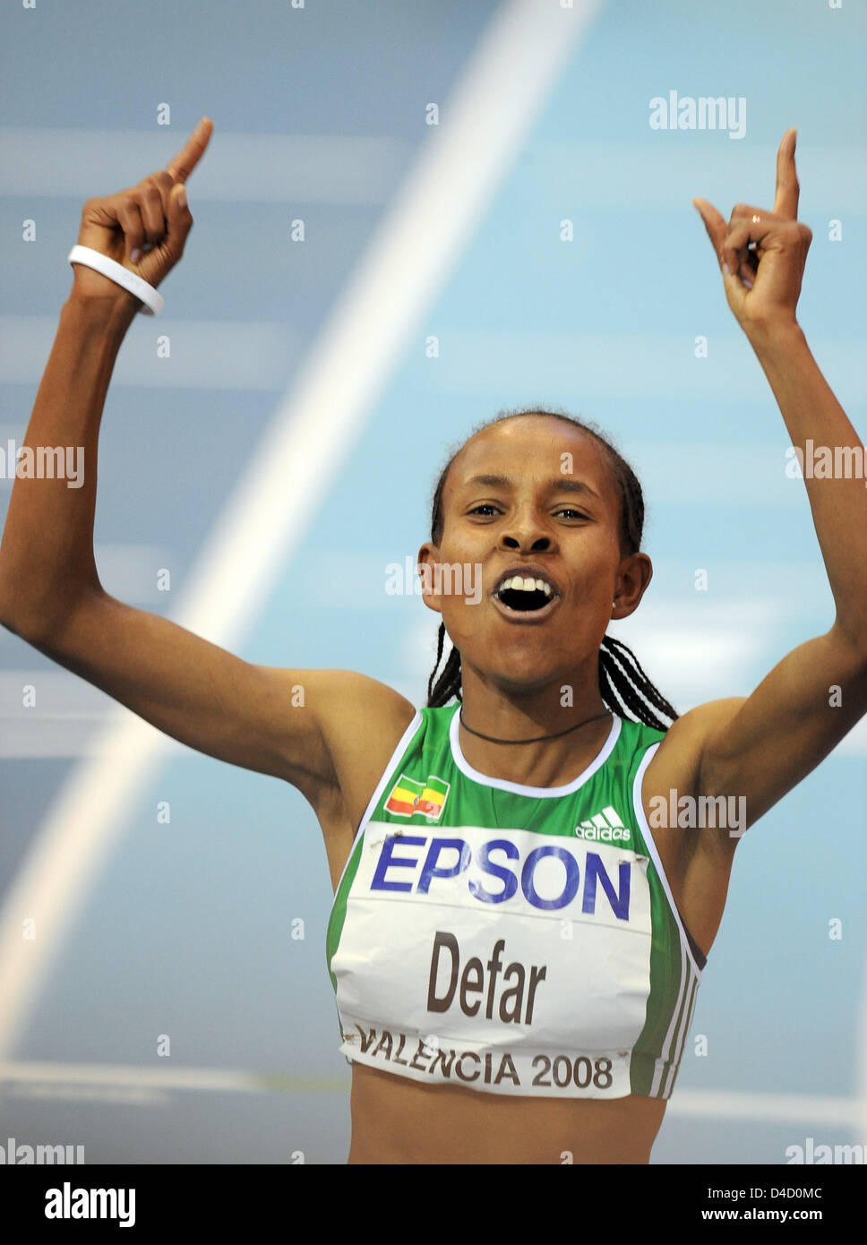Ethiopian athlete Meseret Defar cheers after winning the Women's 3000m ...
