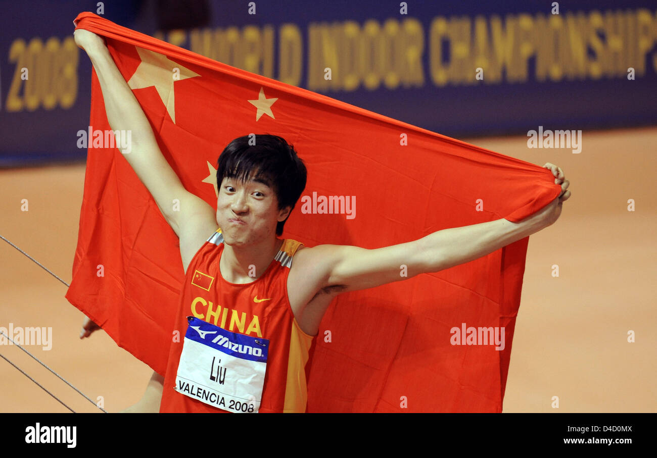 Chinese athlete Xiang Liu celebrates after winning gold in the finale ...
