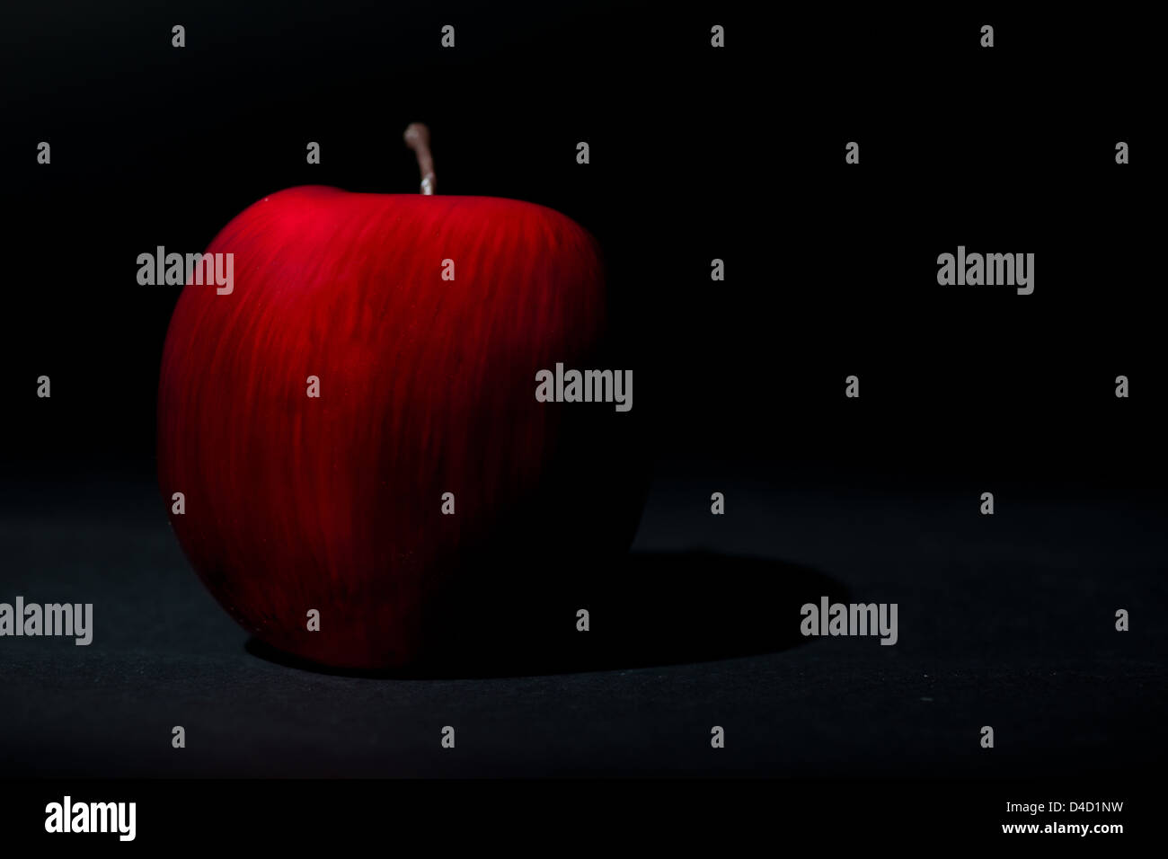 Red apple on black background Stock Photo - Alamy