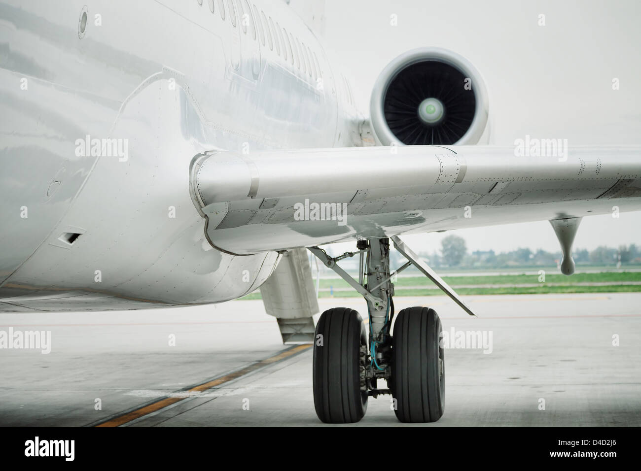 wing and engine of passenger airplane in airport Stock Photo - Alamy