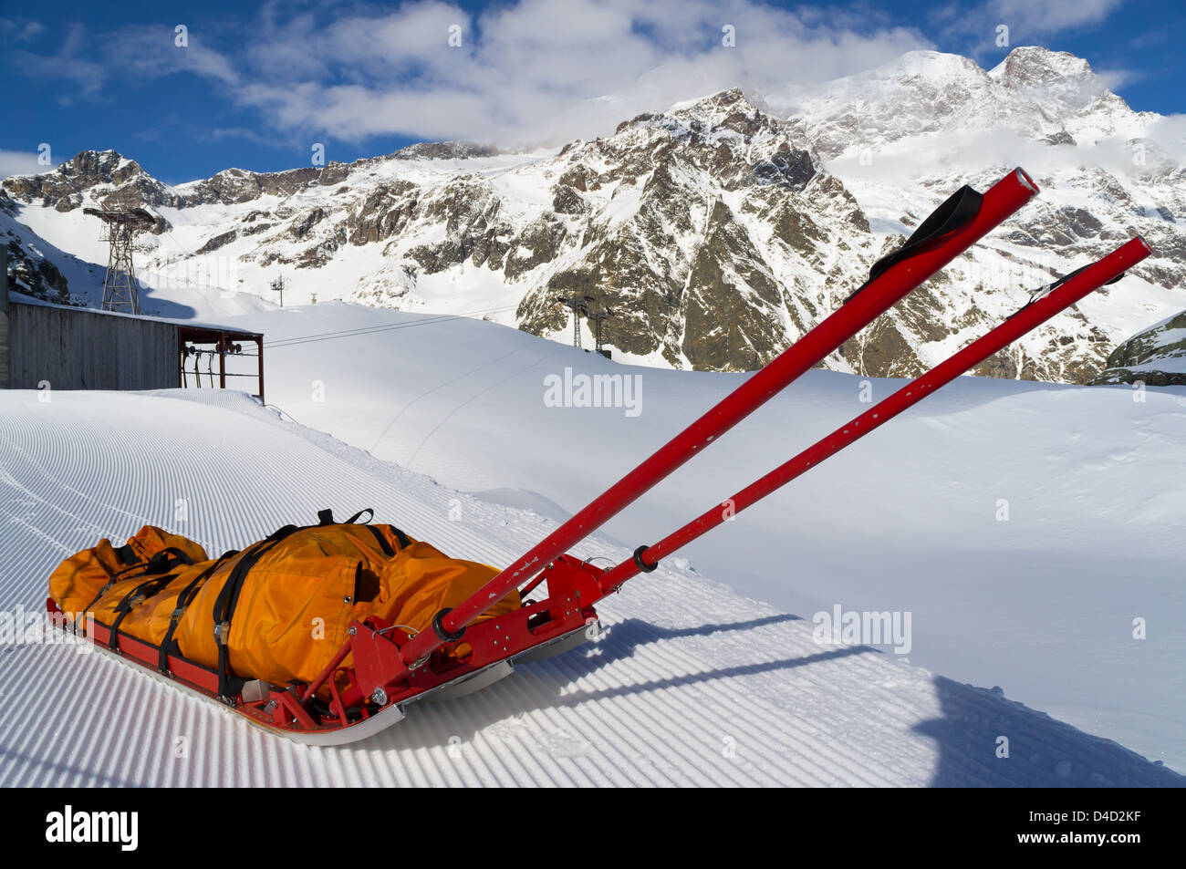 Empty mountain rescue sled over snow on mountain Stock Photo - Alamy