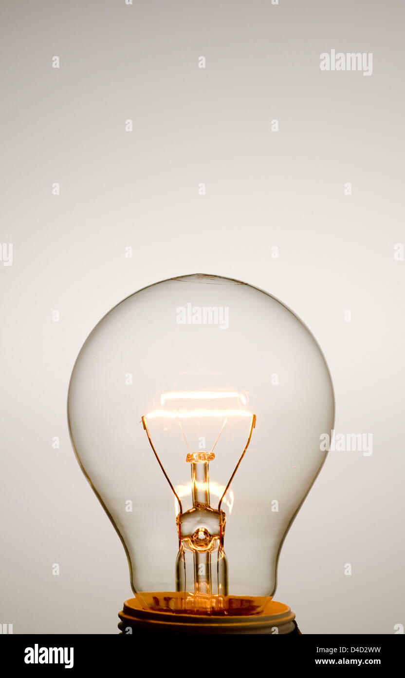 The picture shows a glowing filament in a conventional light bulb in ...