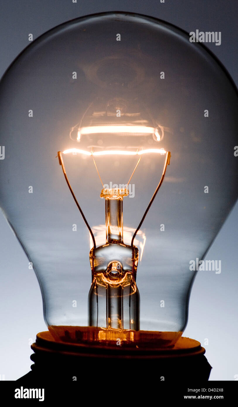 The picture shows a glowing filament in a conventional light bulb in ...