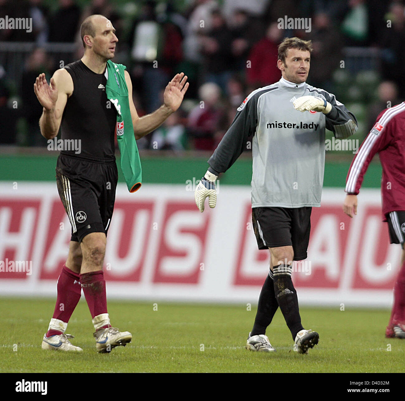 Jan Koller (L) and goalkeeper Jaromir Blazek (both Czechia) walk across ...