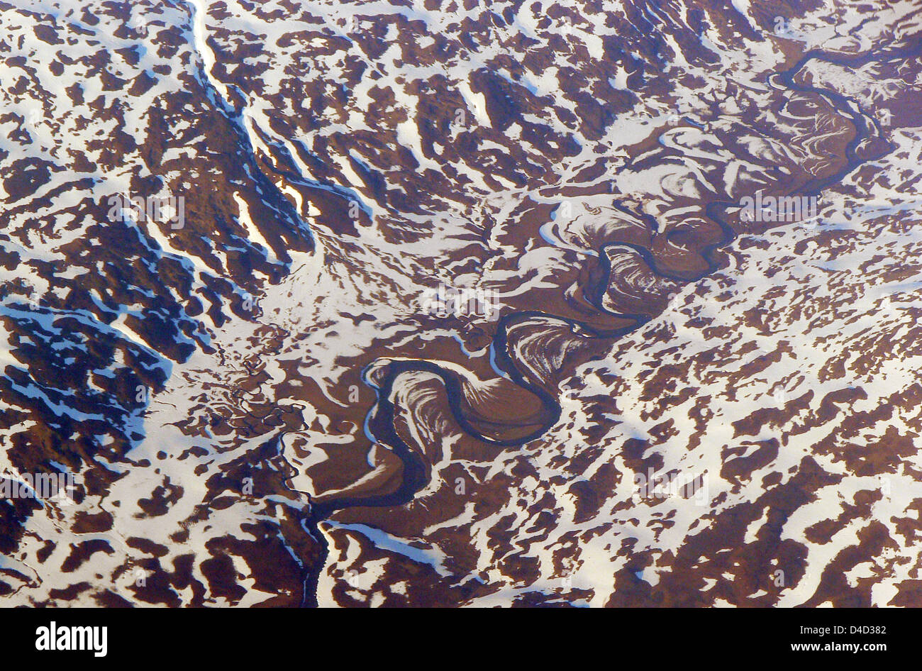 An aerial view of a snow covered meander landscpae in central Sweden ...