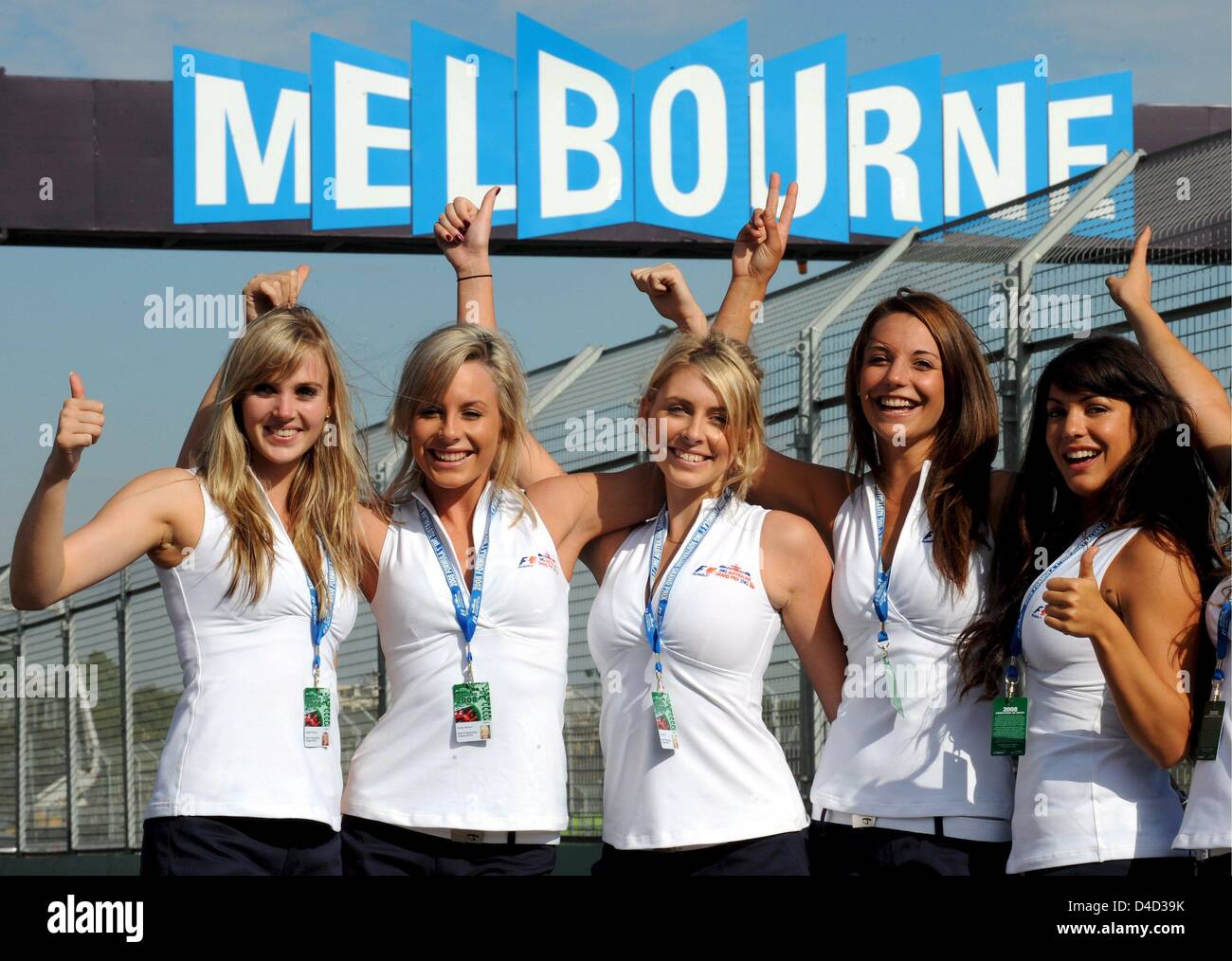 Models pose in front of the Melbourne sign at the Albert Park Circuit ...