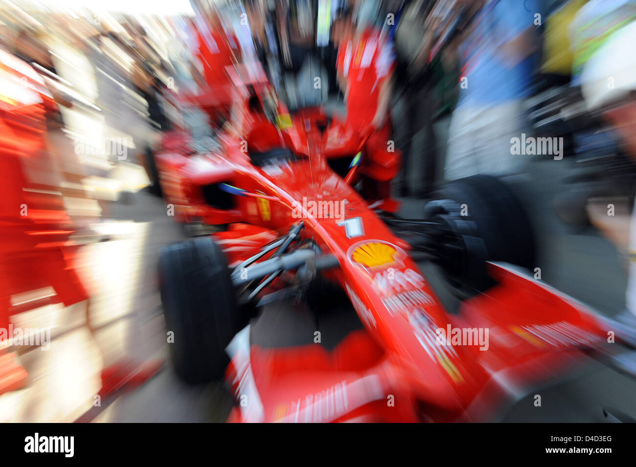 A Ferrari race car parked in the pit lane of Albert Park Circuit in ...