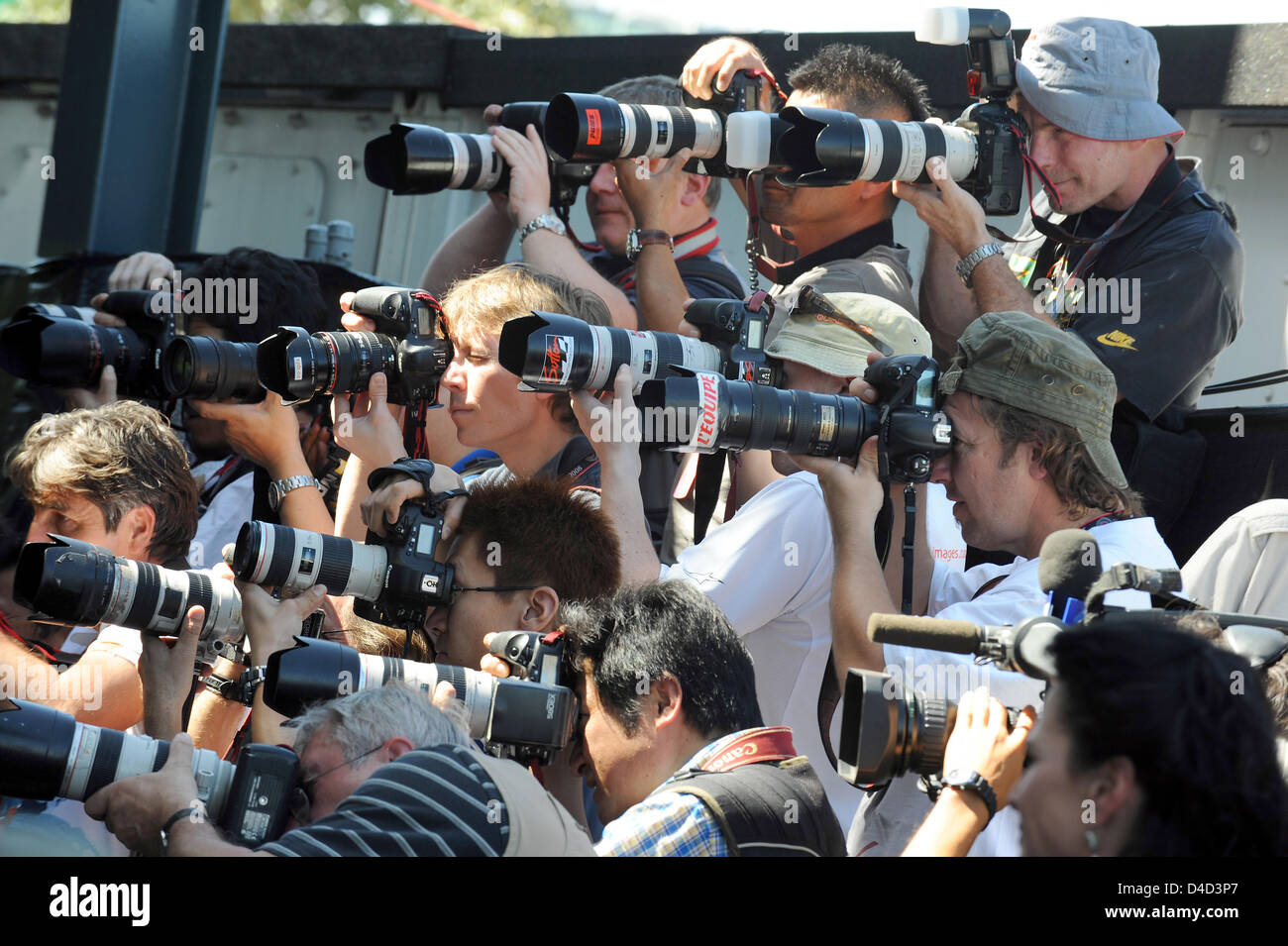 Photographers focused to one of the Formula One drivers posing during a ...
