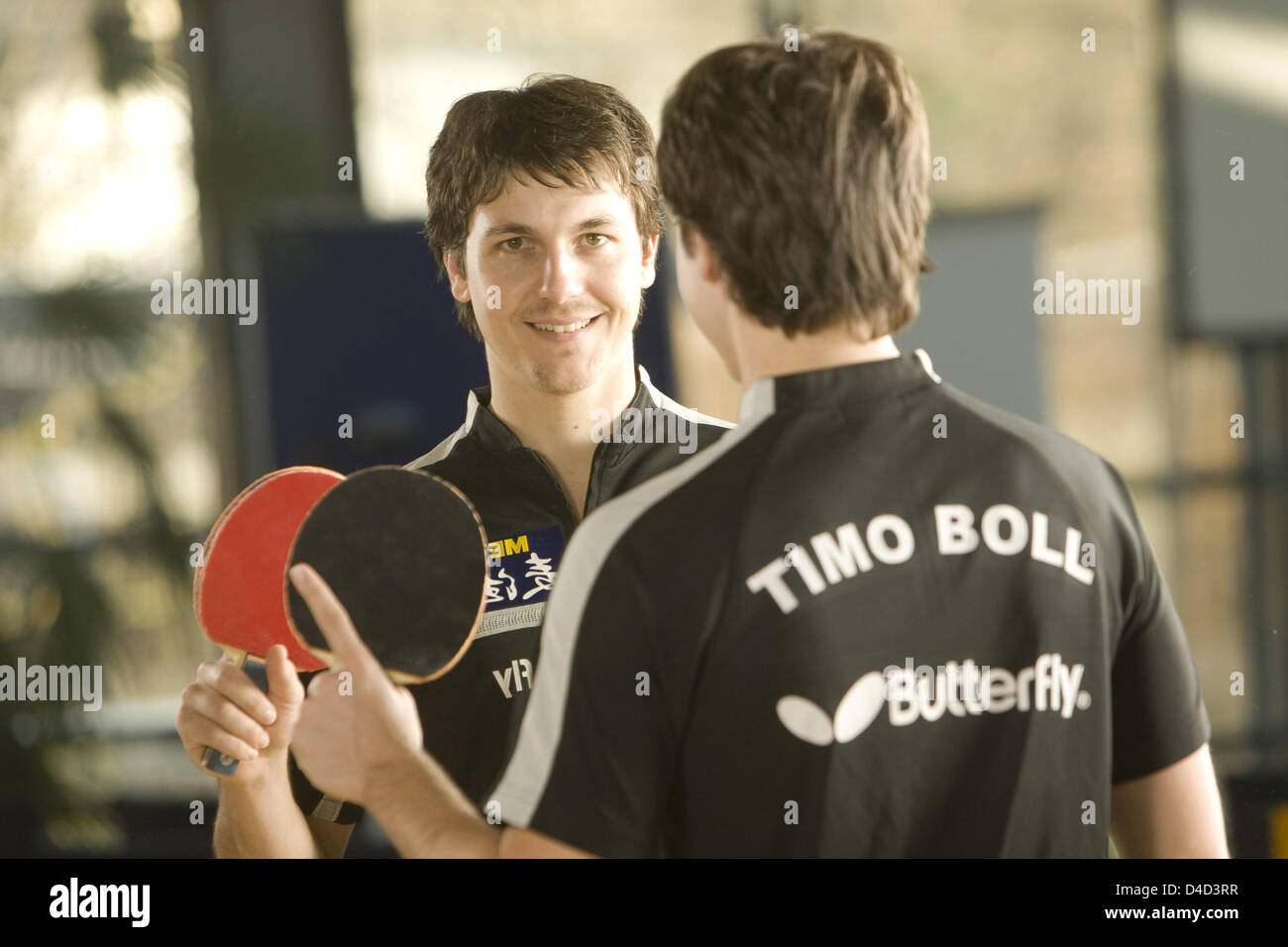 German table tennis pro Timo Boll smiles in the mirror during a photo ...