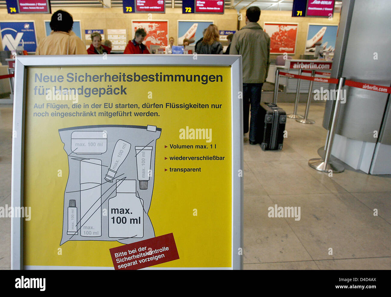 A sign informs passenger on the safety regulations for hand luggage ...