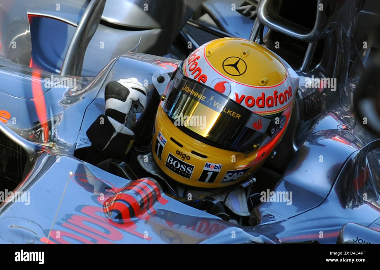 British Formula One driver Lewis Hamilton celebrates in his race car ...