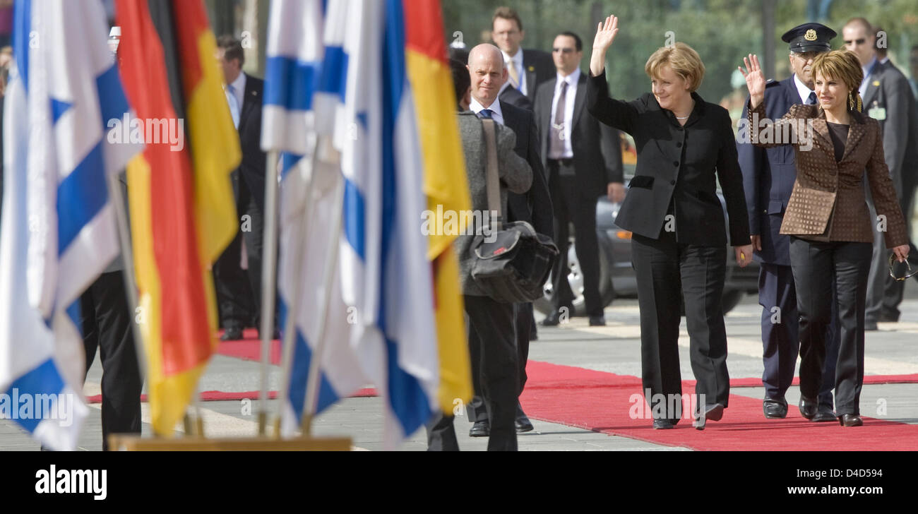 German Chancellor Angela Merkel (C) is welcomed by Knesset Speaker ...