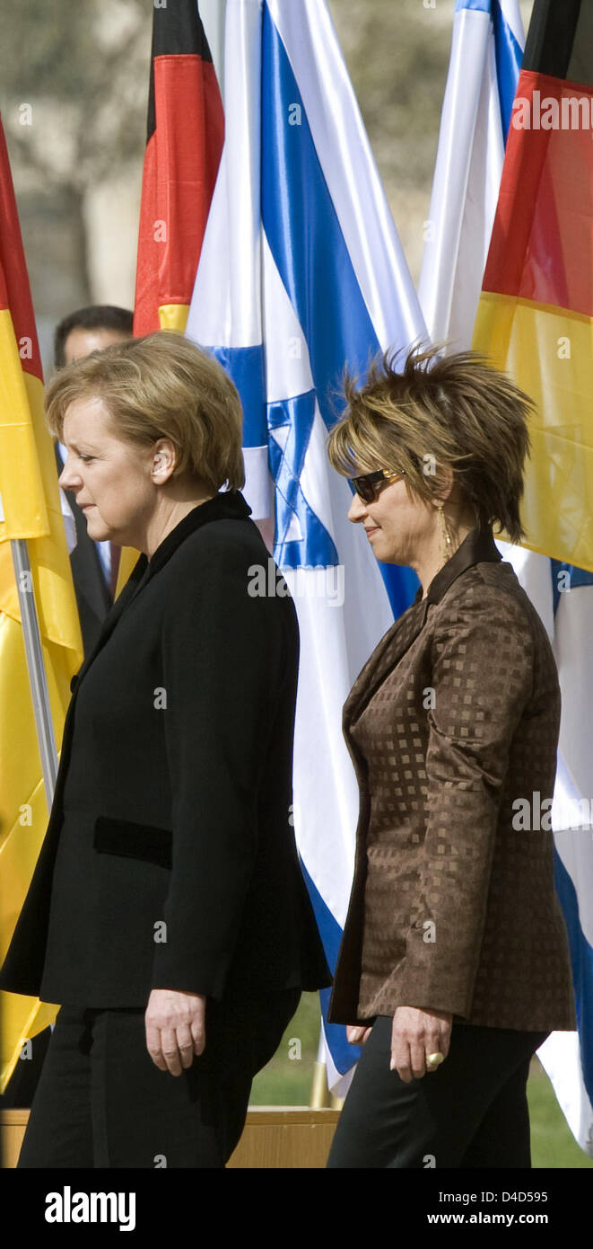 German Chancellor Angela Merkel (L) is welcomed by Knesset Speaker ...