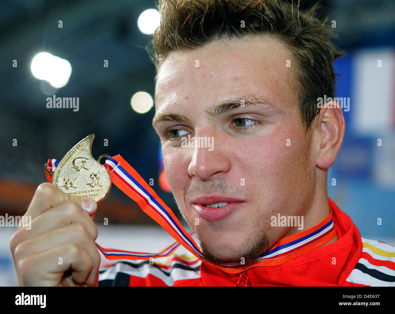 Paul Biedermann of Germany shows his gold medal he won in the men's ...