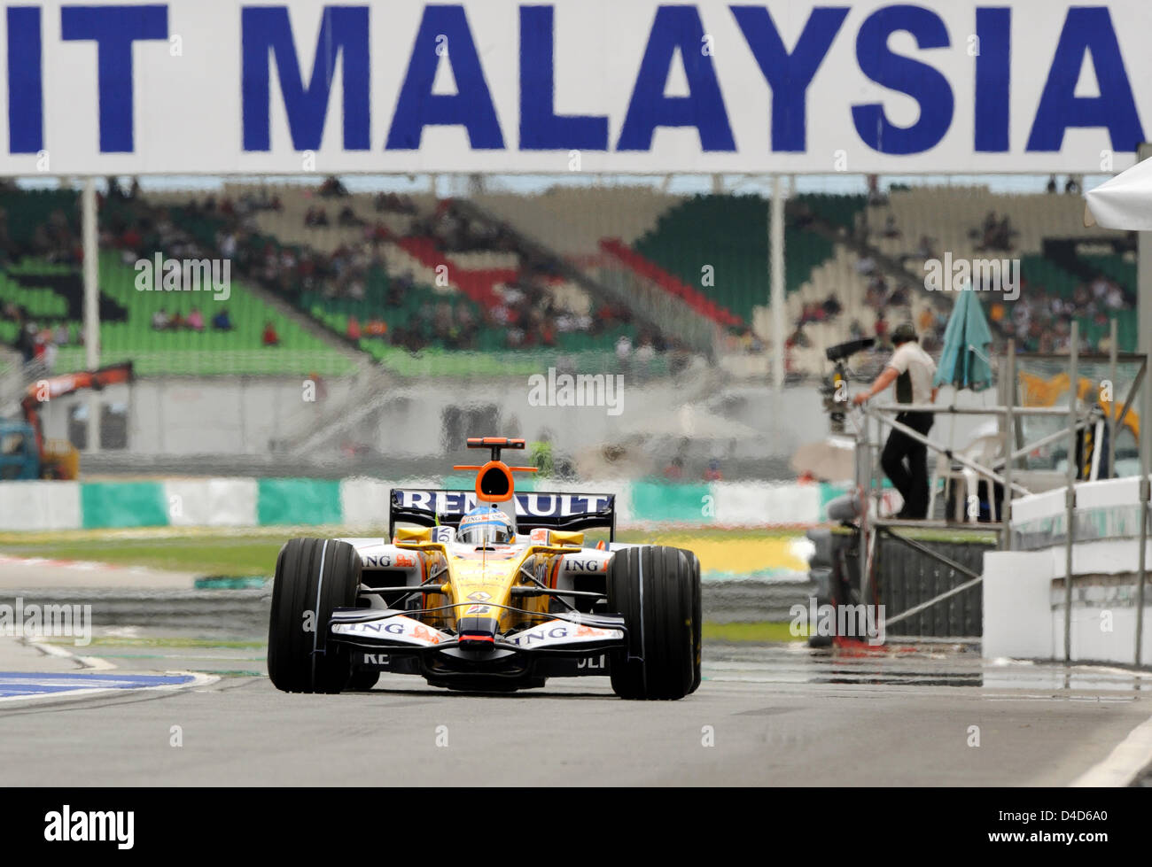 Spanish Formula One driver Fernando Alonso of Renault F1 enters the pit ...