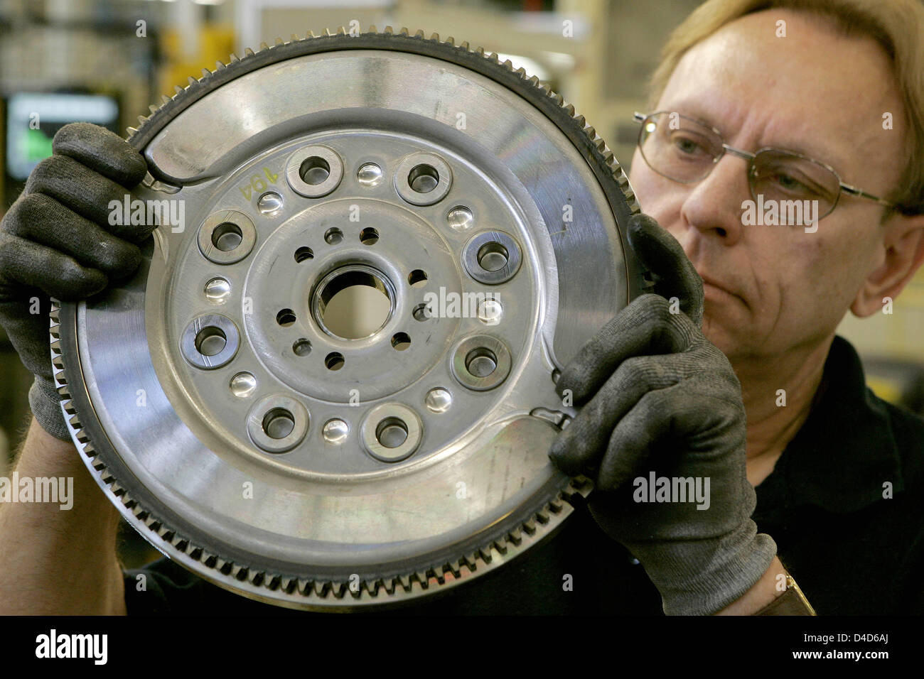 An employee of powertrain and suspension components producer ZF Sachs ...